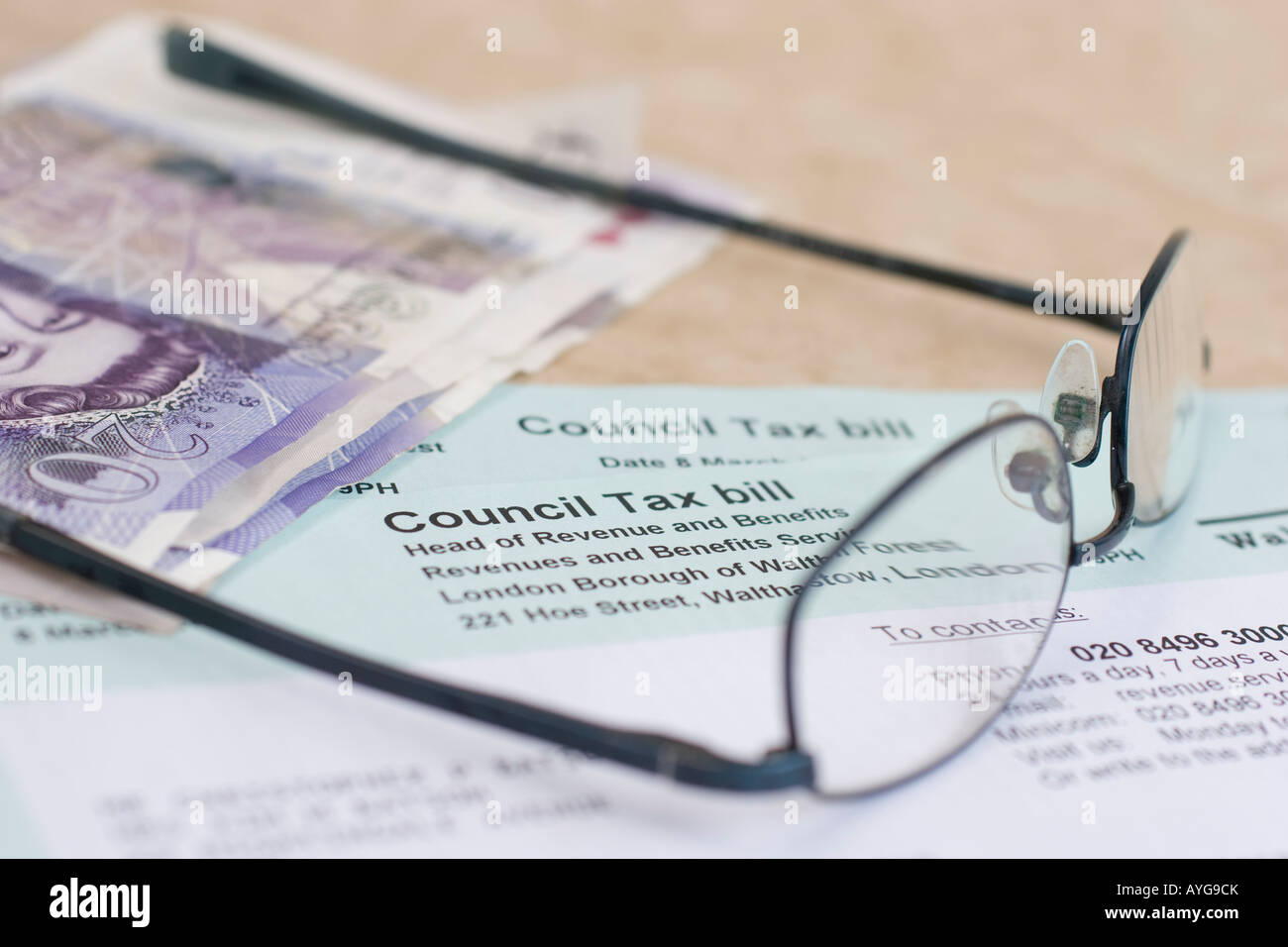 UK council tax bill with eyeglasses and cash Stock Photo - Alamy