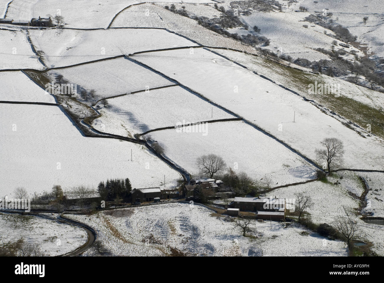 Farmhouse and fields covered in snow view from Teggs Nose Country Park ...