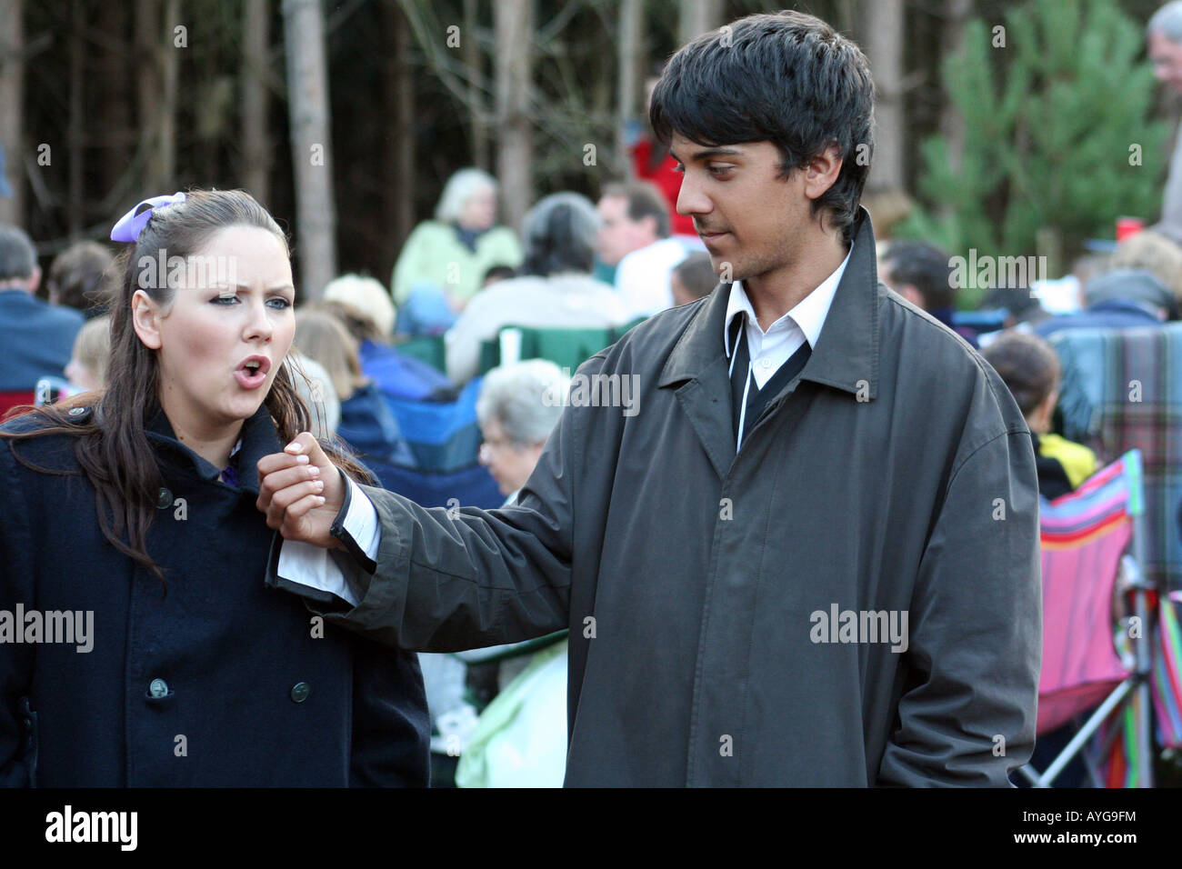 Two young actors conduct an imaginary interview outdoors Stock Photo ...