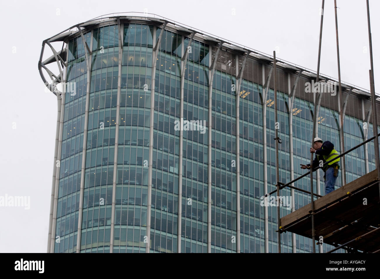 scaffolding scaffolder builder erecting scaffold at height with City ...