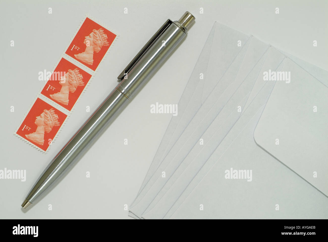 United Kingdom First Class Postage Stamps and Pen on Writing Paper Next ...