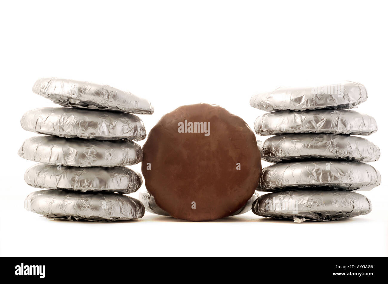 a selection of foil wrapped dark and milk chocolate round biscuits ...