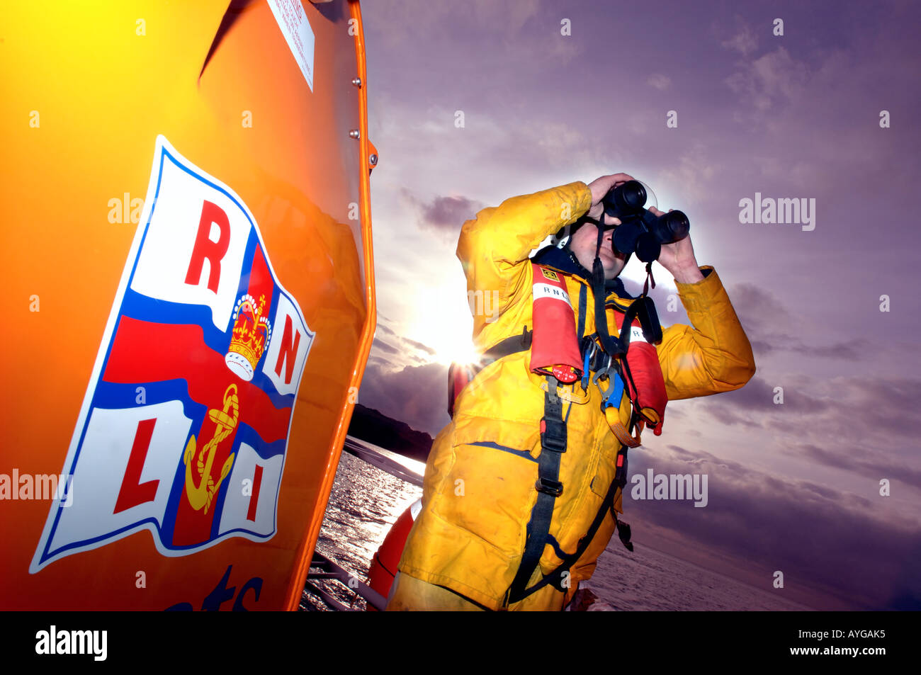 An RNLI crewman on lookout duty off the north devon coast Stock Photo ...