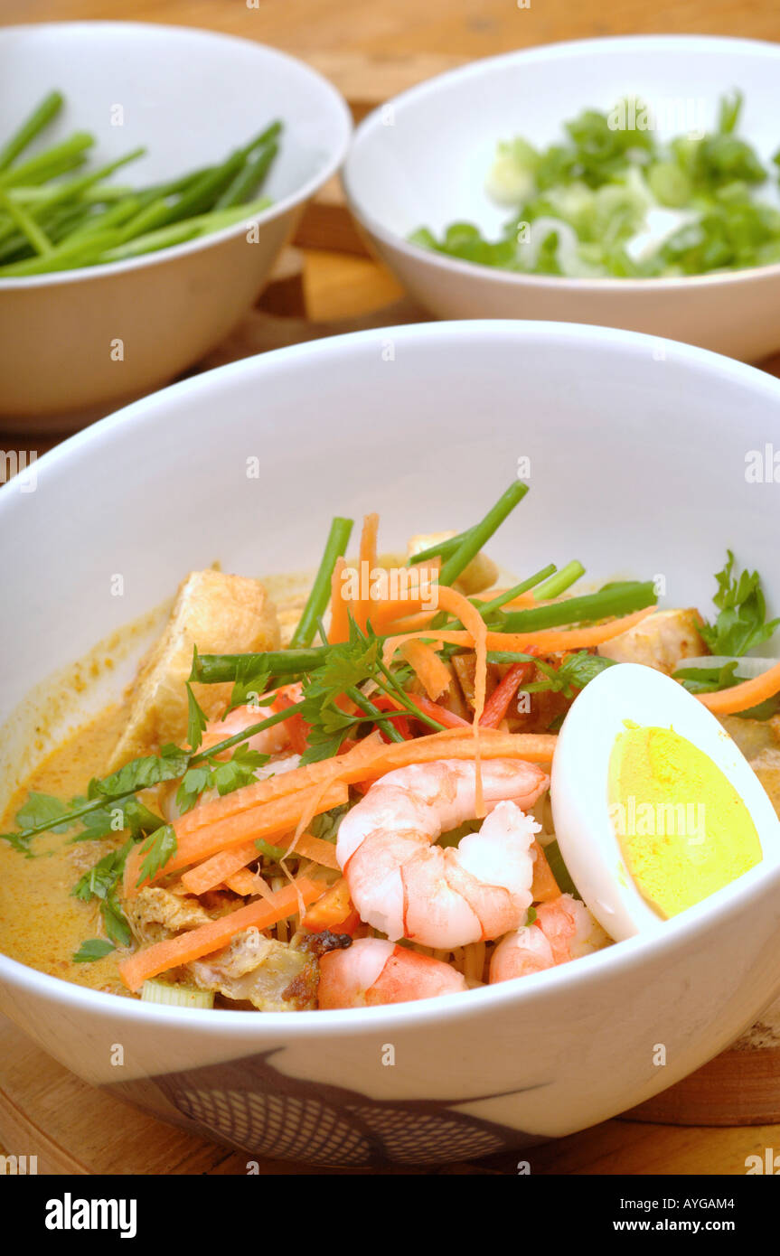making a Malaysian Laksa food dish Stock Photo - Alamy