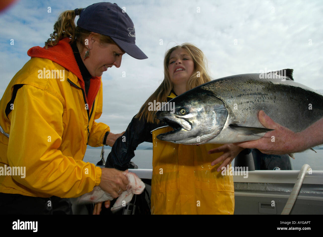 girl about to hold salmon Stock Photo - Alamy