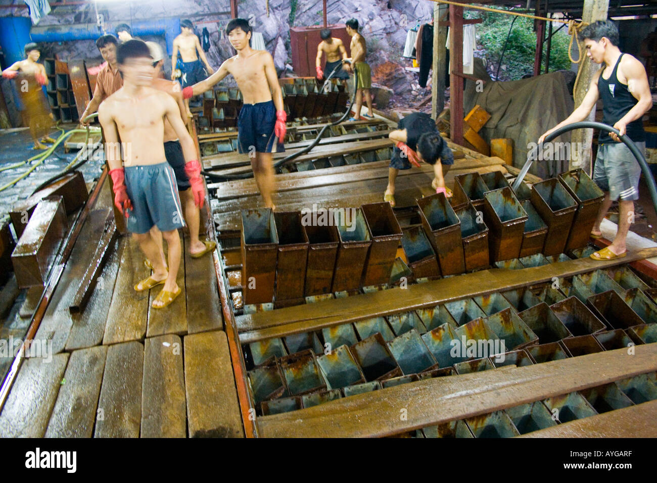 Men Working in an Ice Factory producing ice for the fishing boats that ...