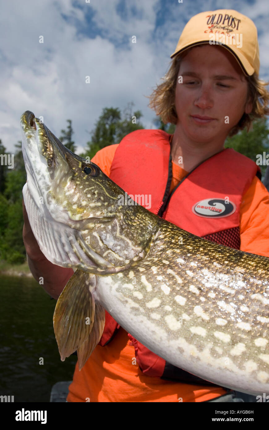 young man with big pike in northern Ontario Stock Photo - Alamy