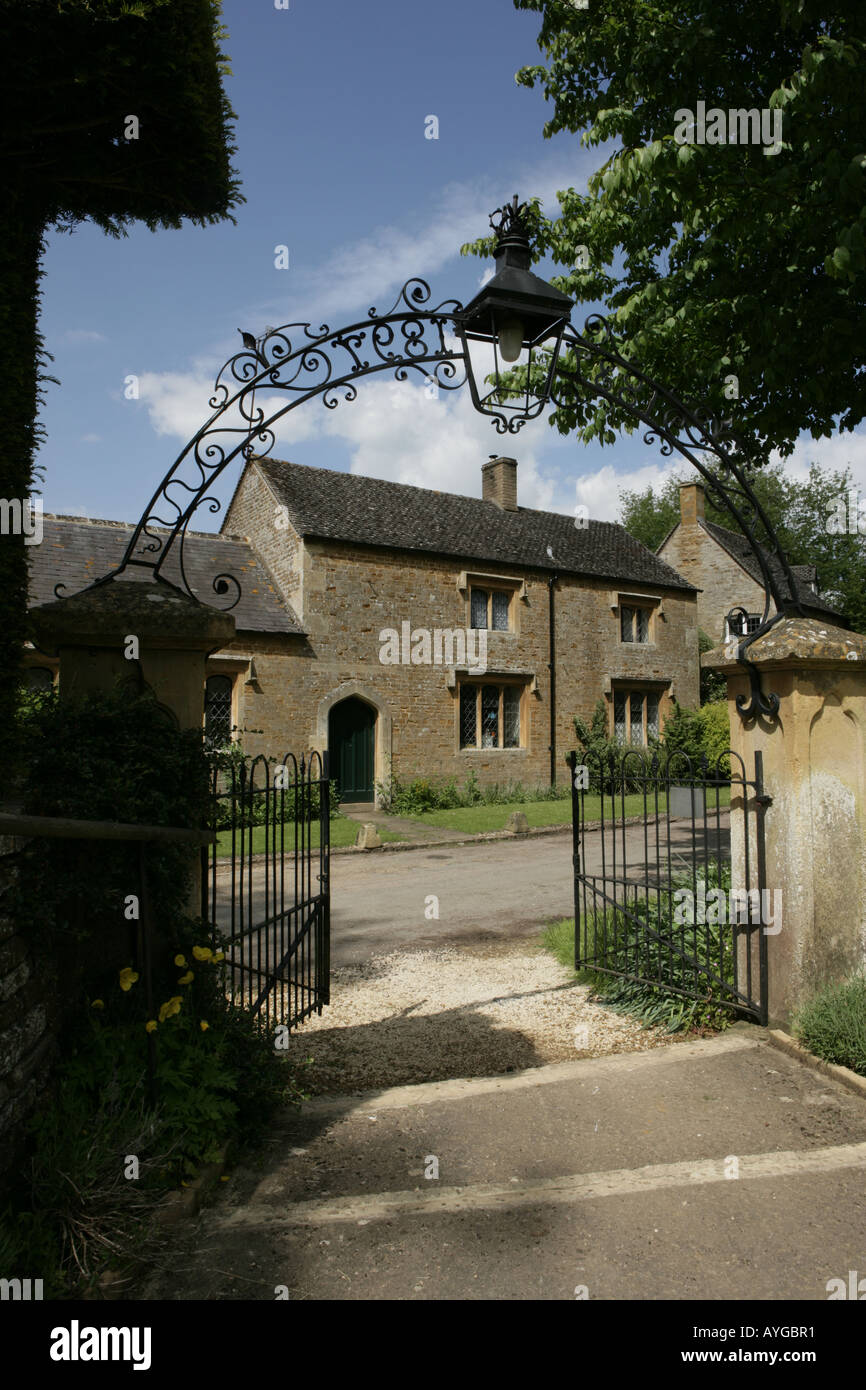the church gate and lamp in the Cotswold village of Adlestrop, the ...