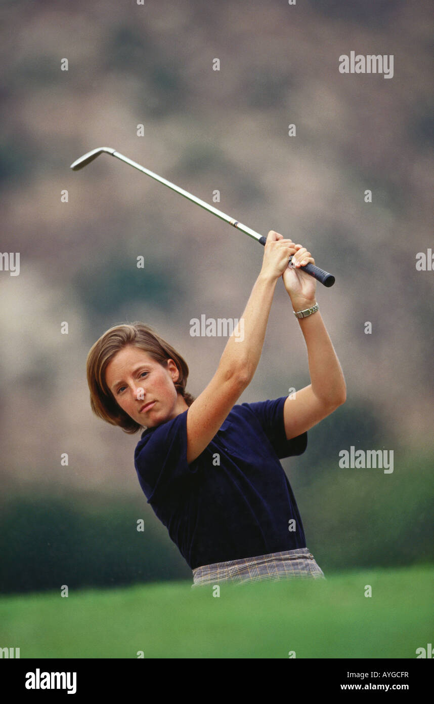 Woman golfer in action Stock Photo - Alamy