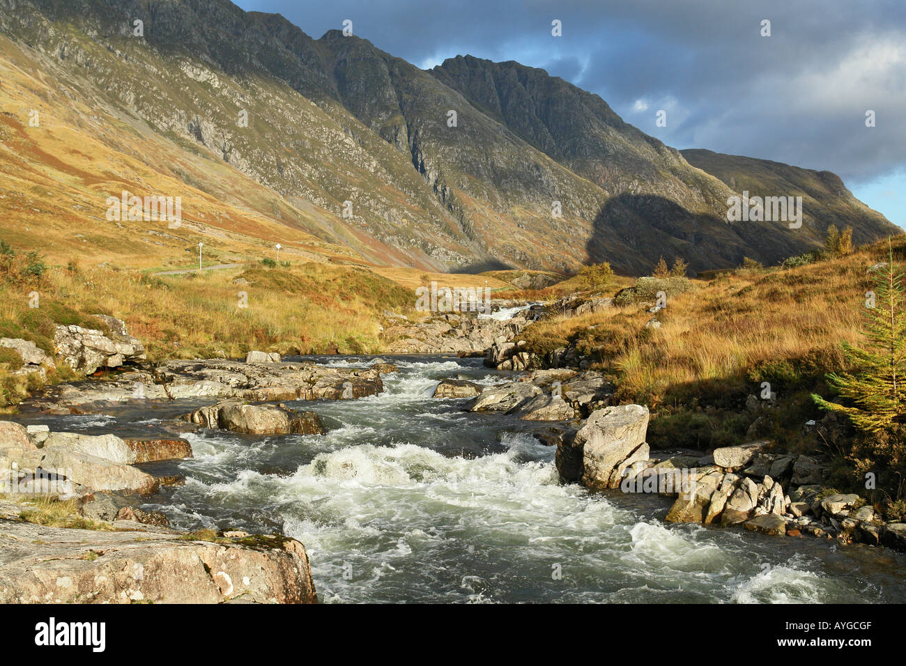 Spectacular view of River Coe rushing down Glen Coe Highland Scotland ...