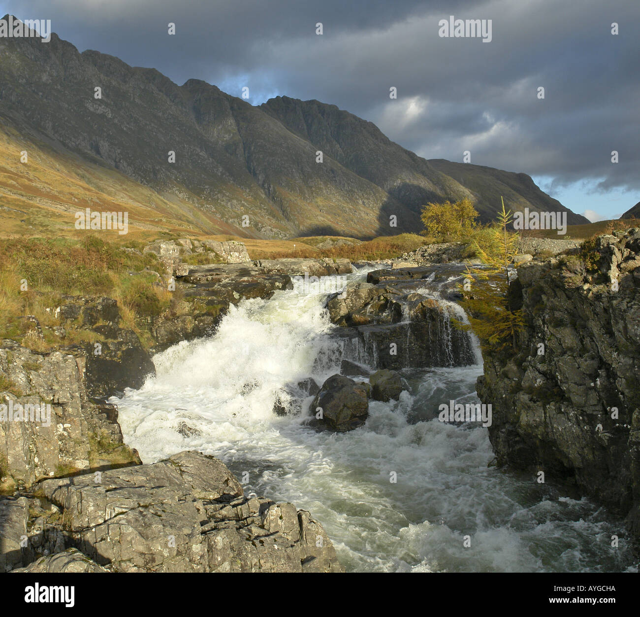 Spectacular view of River Coe rushing down Glen Coe Highland Scotland ...