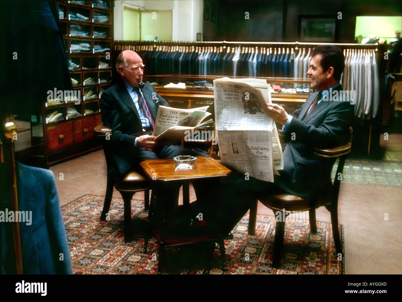 Taking a break reading the Times Newspaper tailors from Huntsman mens ...