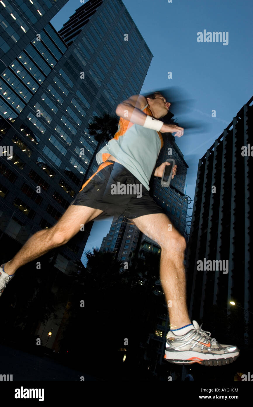 Male Runner in City at Night Stock Photo - Alamy