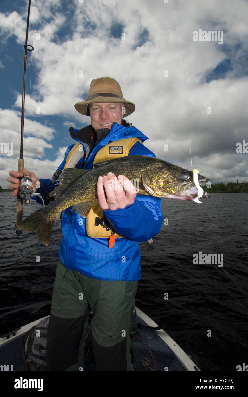 man with walleye with jig in mouth Stock Photo - Alamy