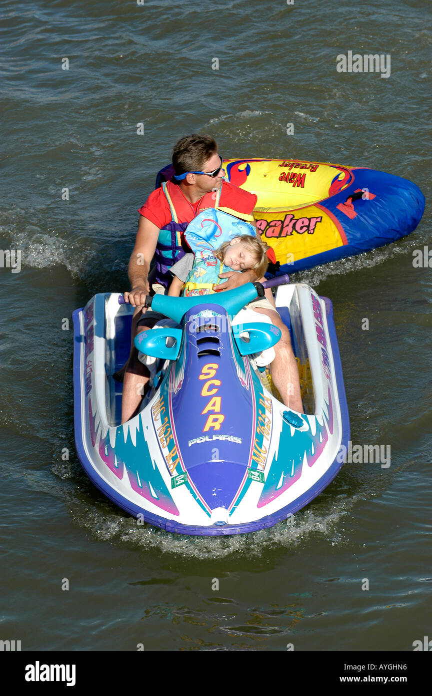 Family having fun boating on the water together Stock Photo - Alamy