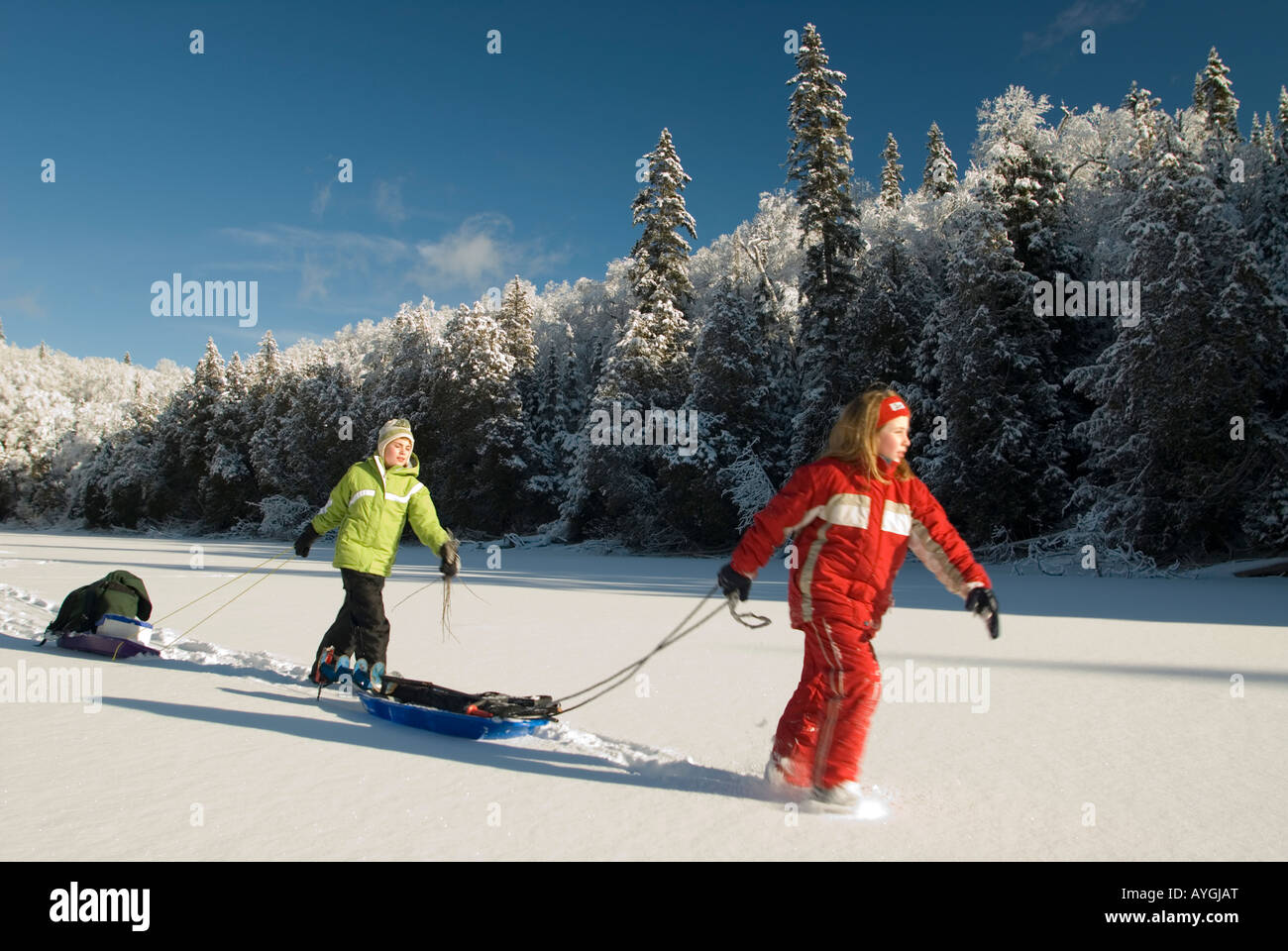 Girls with sleds hi-res stock photography and images - Alamy