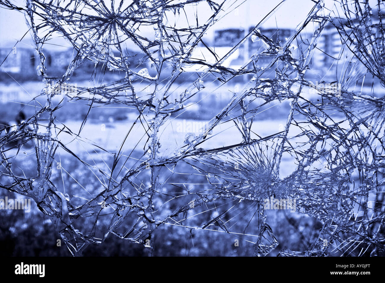 Broken window dark blue toned Stock Photo - Alamy