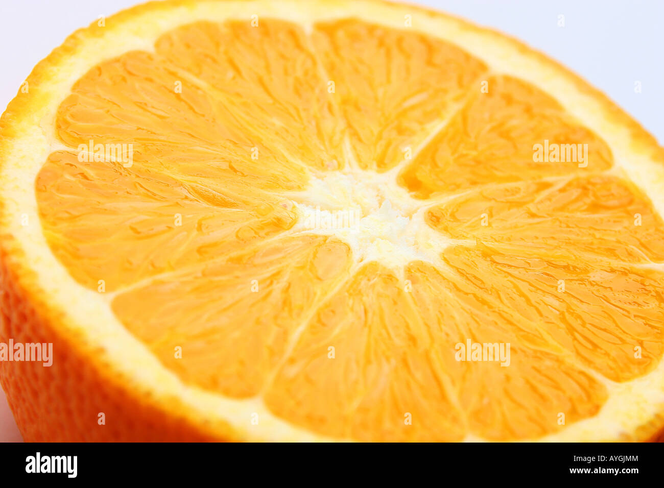 Close up of orange cut in half Stock Photo - Alamy