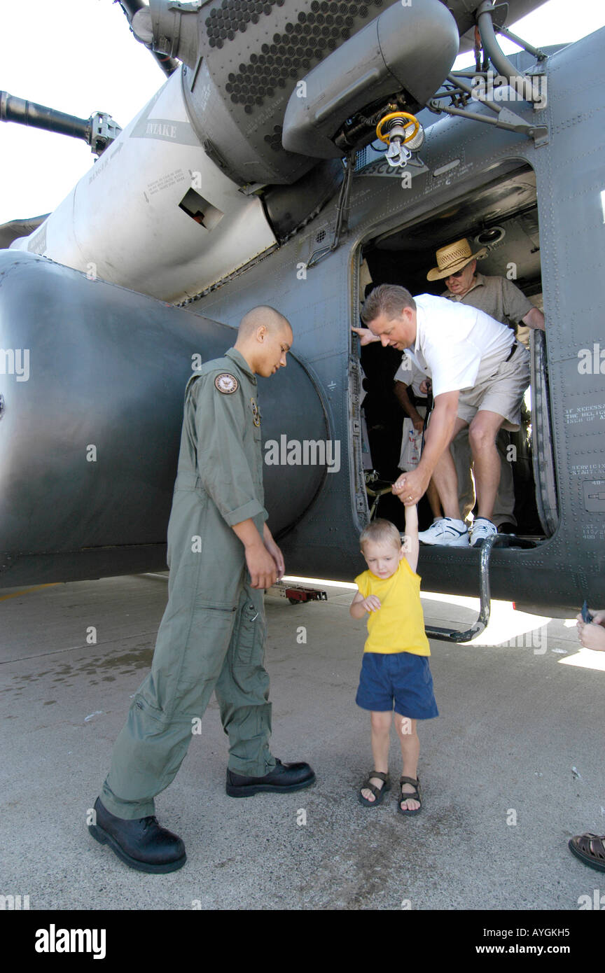 Soldier helping civilian at the Air Show at Selfridge Air Force Base Mt ...