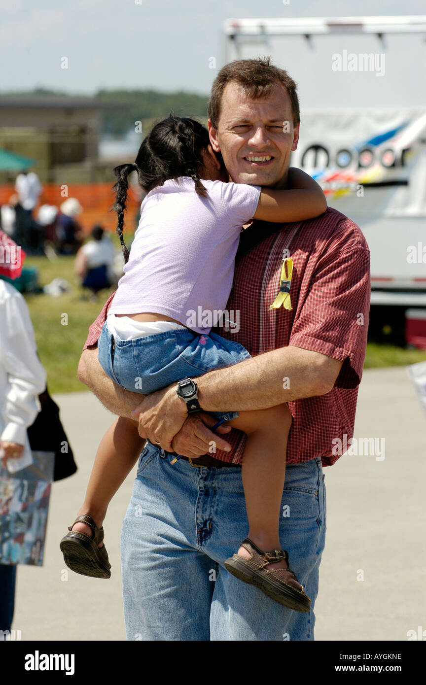 Father holding ethnic adopted daughter Stock Photo - Alamy