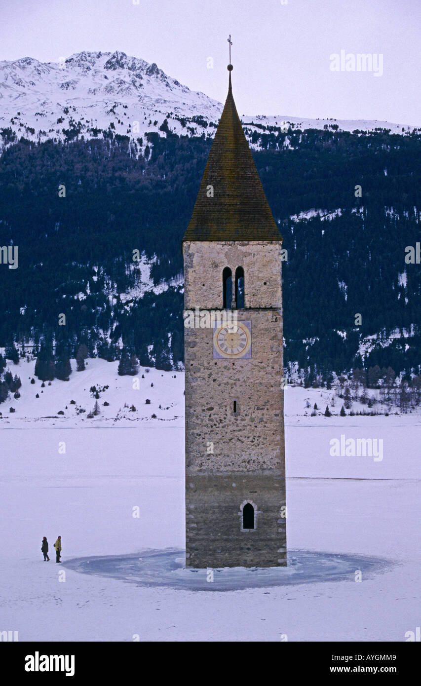 The frozen church tower in the reschensee in winter hi-res stock ...
