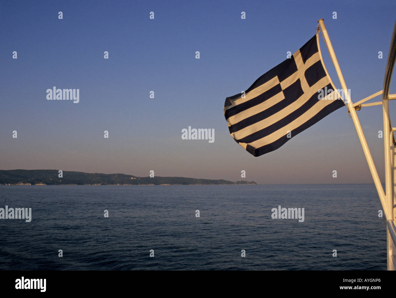 GREEK FLAG FLYING ON A FERRY BOAT OFF THE ZAKINTHOS COAST IONIAN SEA ...