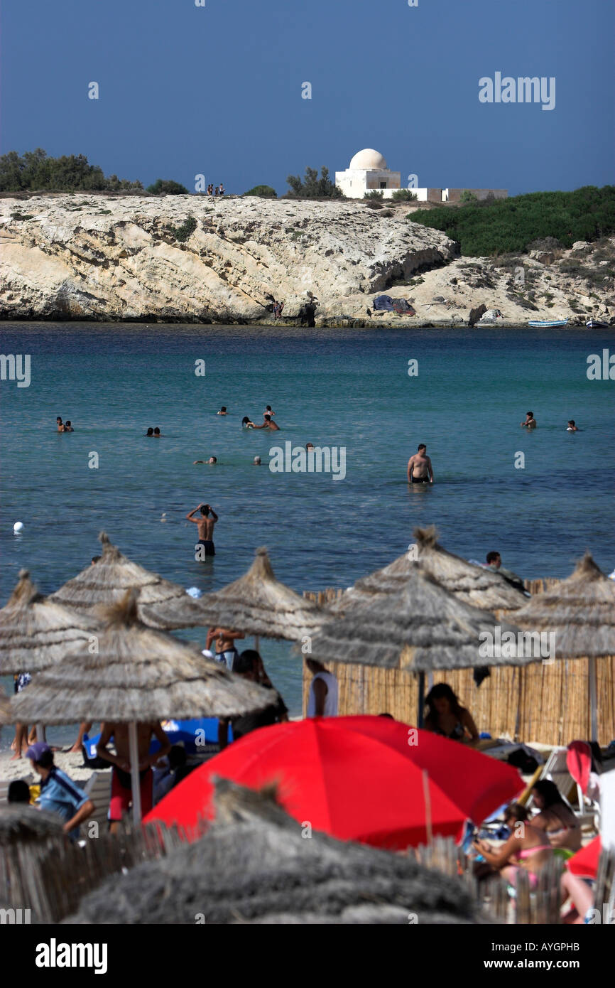Traditional thatch sunshades and umbrella on Monastir Beach where ...
