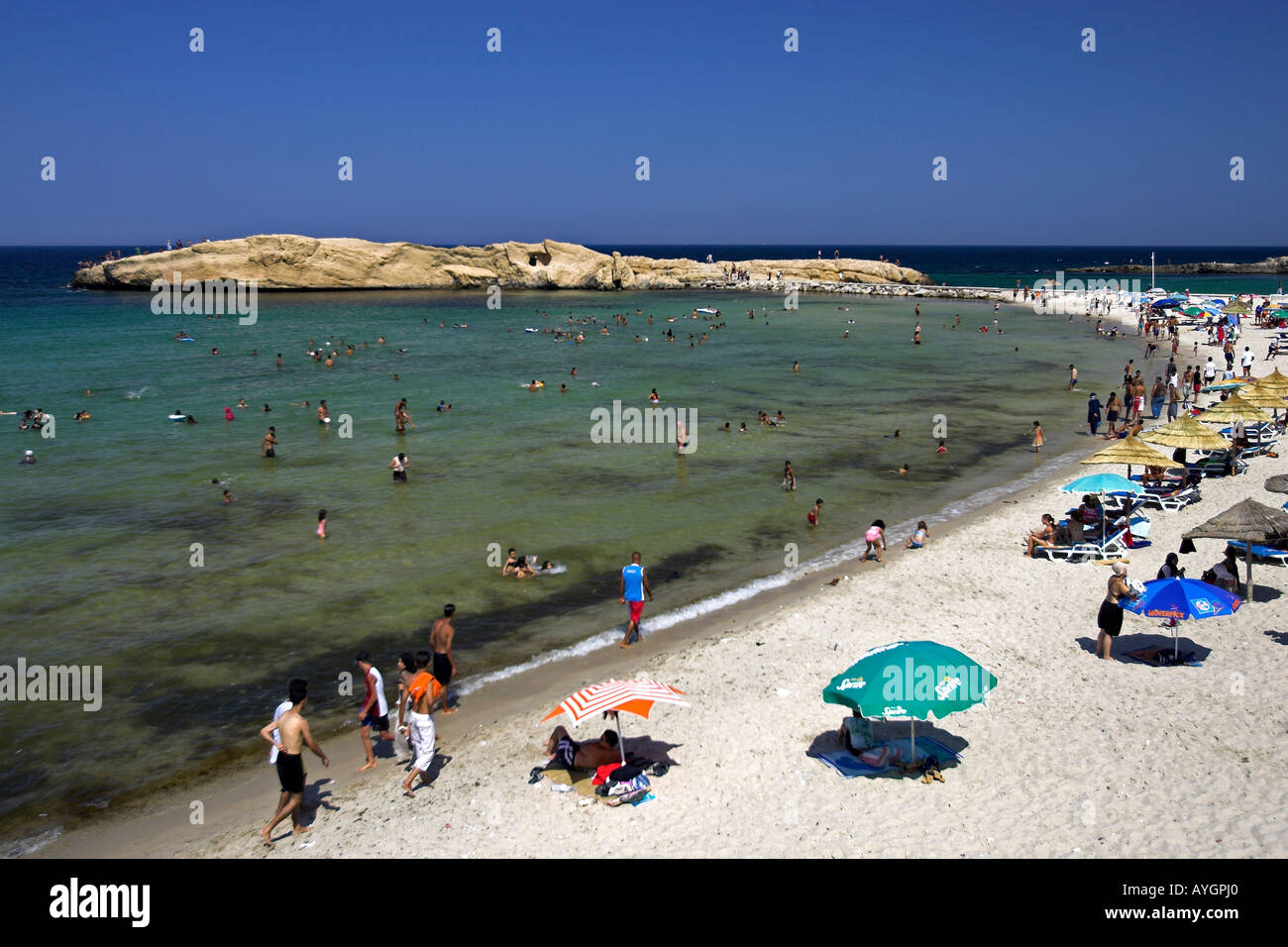 Holidaymakers swim and cool off Monastir Beach Tunisia Stock Photo - Alamy