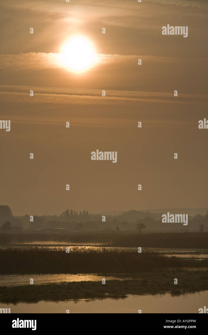 Morning rising sun over a French landscape the River Seine at Honfleur ...