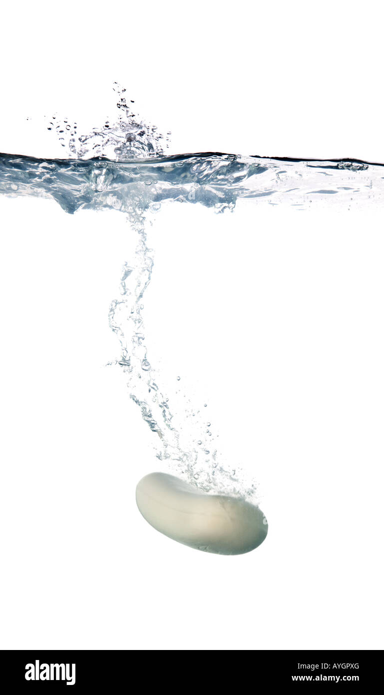 A bar of soap splashing in water Stock Photo - Alamy