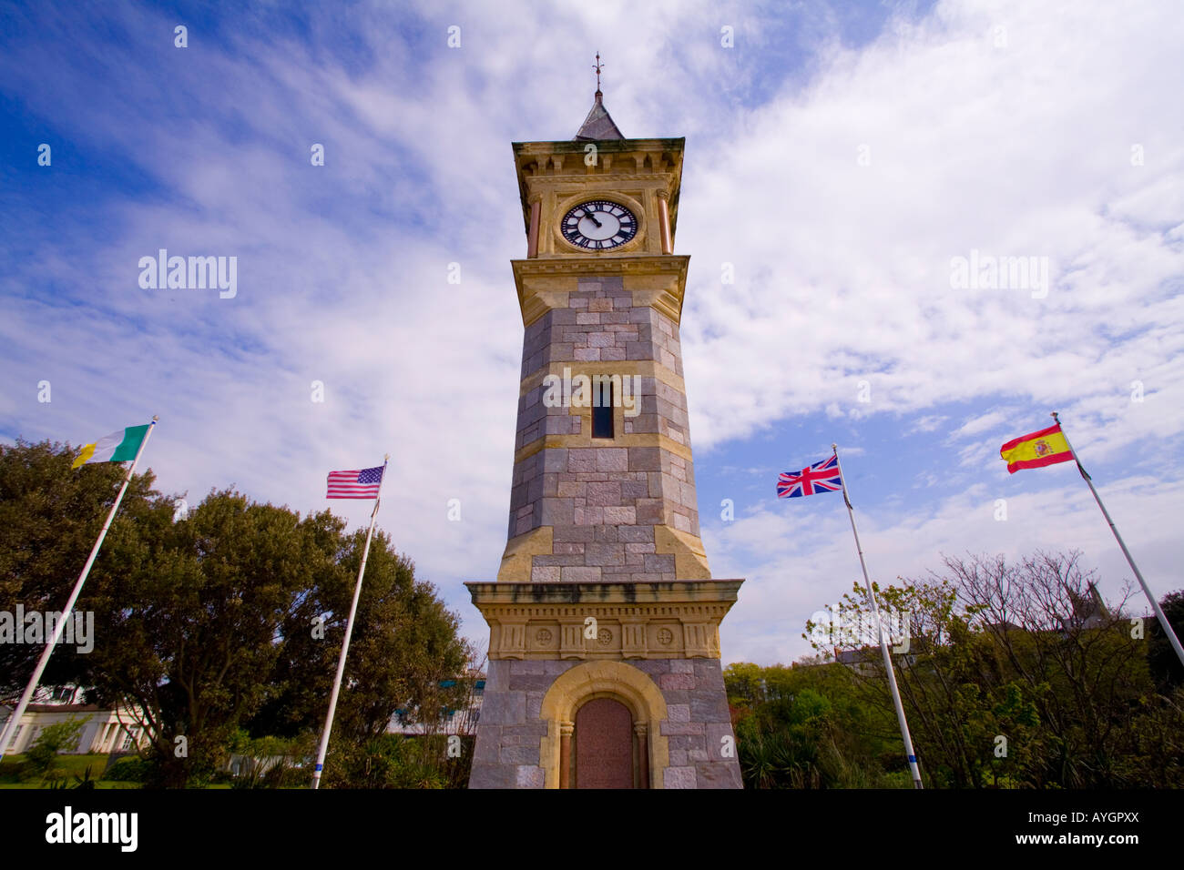Clock Tower with national flags behind on the seafront at Exmouth ...