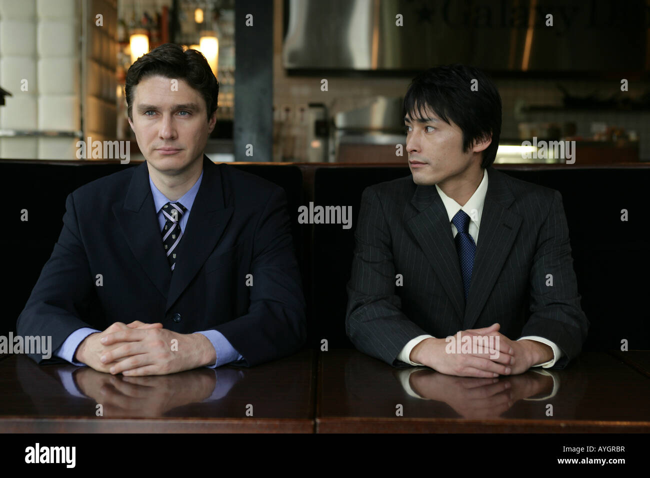 Businessmen waiting in cafe Stock Photo - Alamy