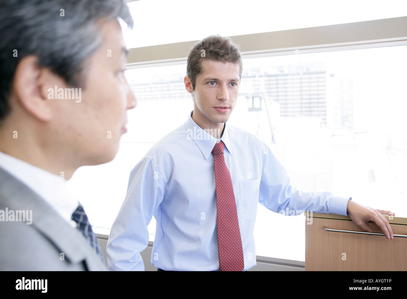 Businessmen in office Stock Photo - Alamy