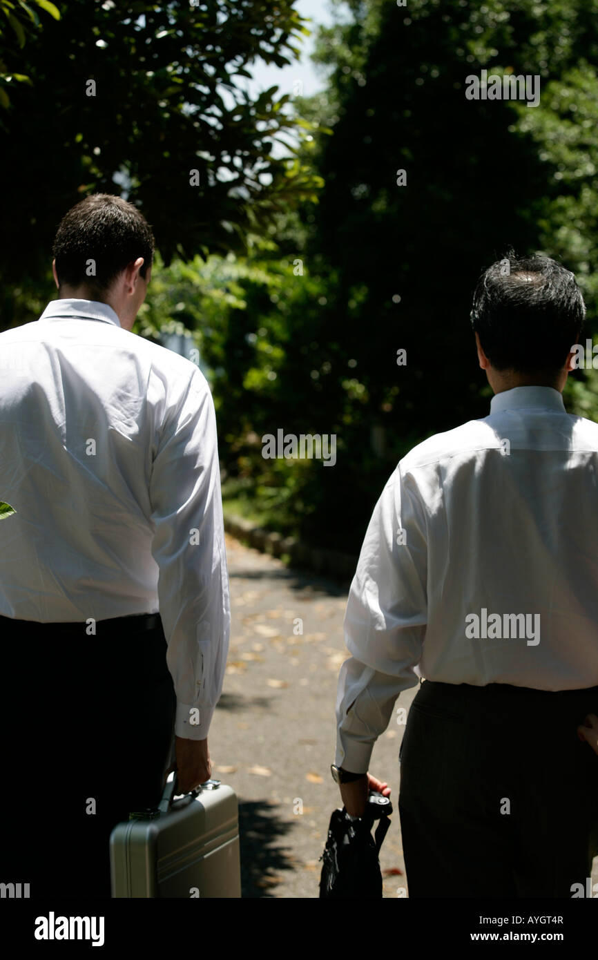 Two businessmen holding briefcases hi-res stock photography and images ...