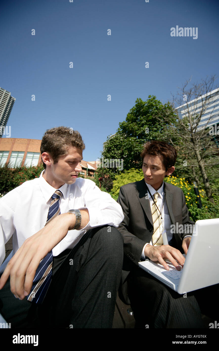 Businessman using two hi-res stock photography and images - Alamy
