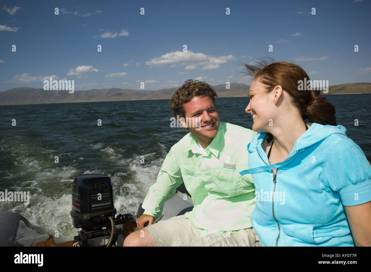 Young man sitting on motor boat hi-res stock photography and images - Alamy