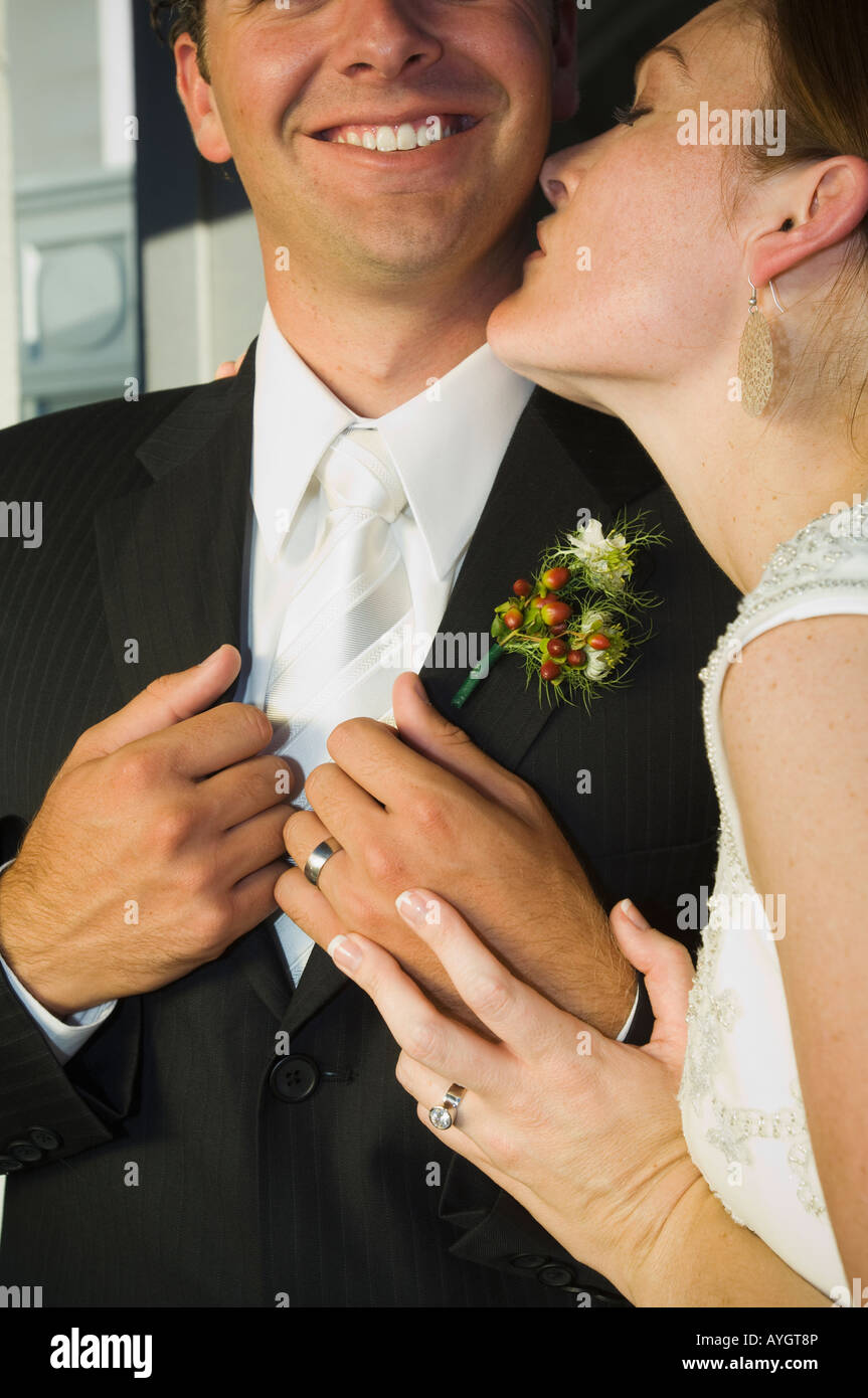 Close up of bride kissing groom Stock Photo - Alamy