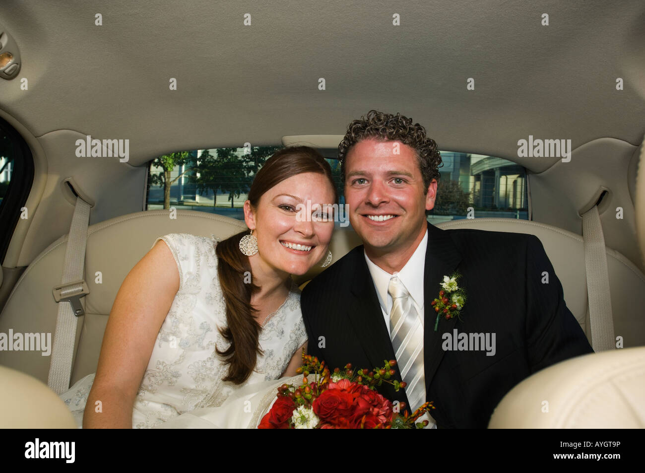 Bride and groom in limousine Stock Photo - Alamy