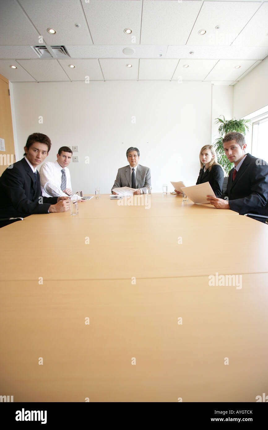 Portrait of five business people sitting in conference room Stock Photo ...