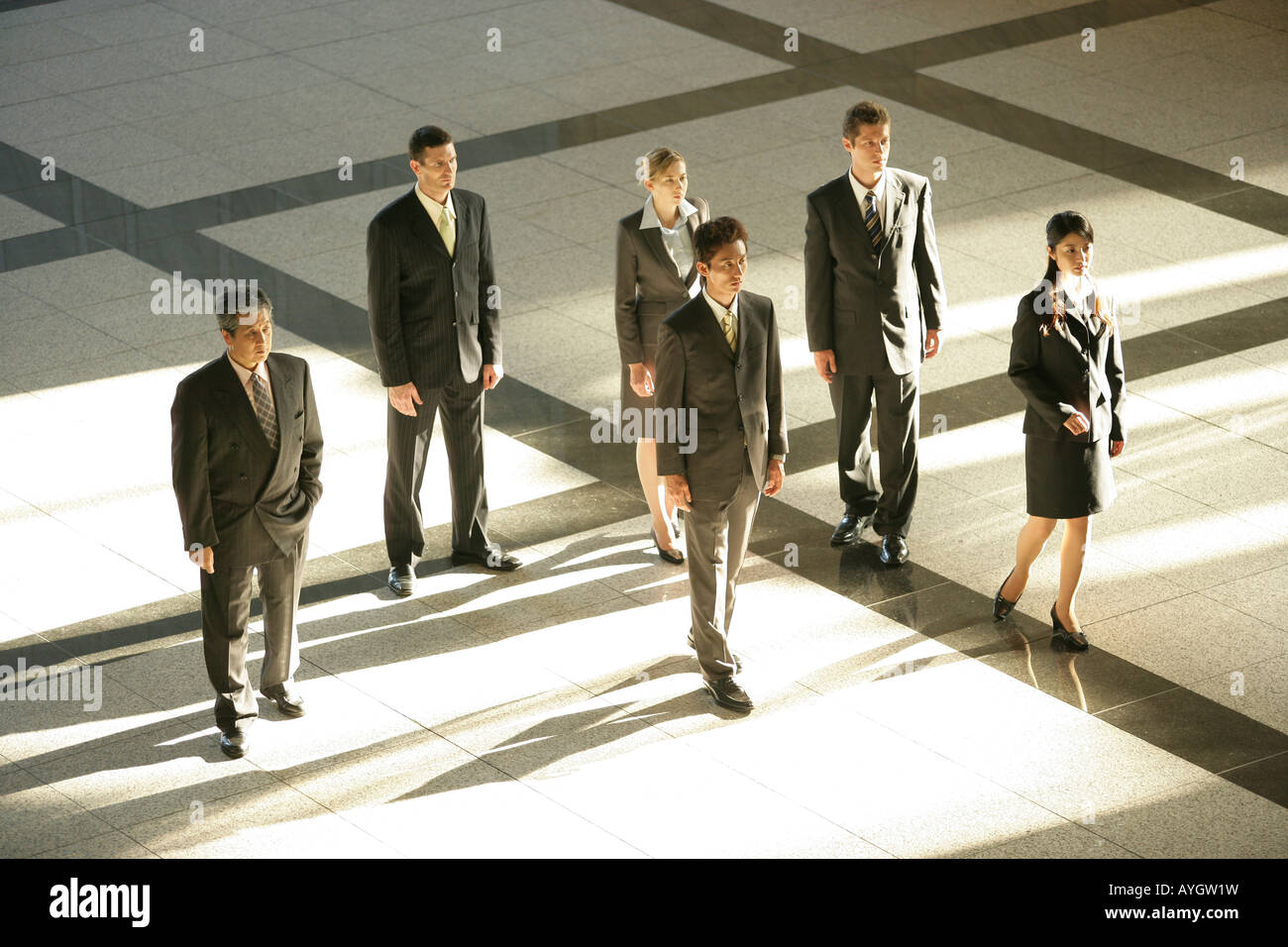 Group of businesspeople in lobby Stock Photo - Alamy