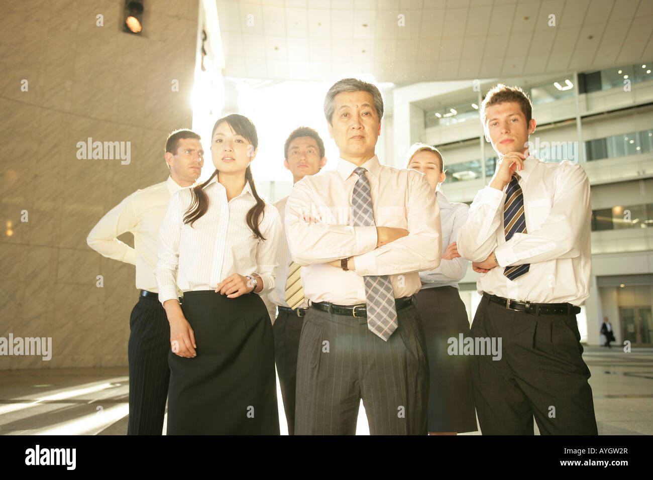 Group portrait of businesspeople in lobby Stock Photo - Alamy