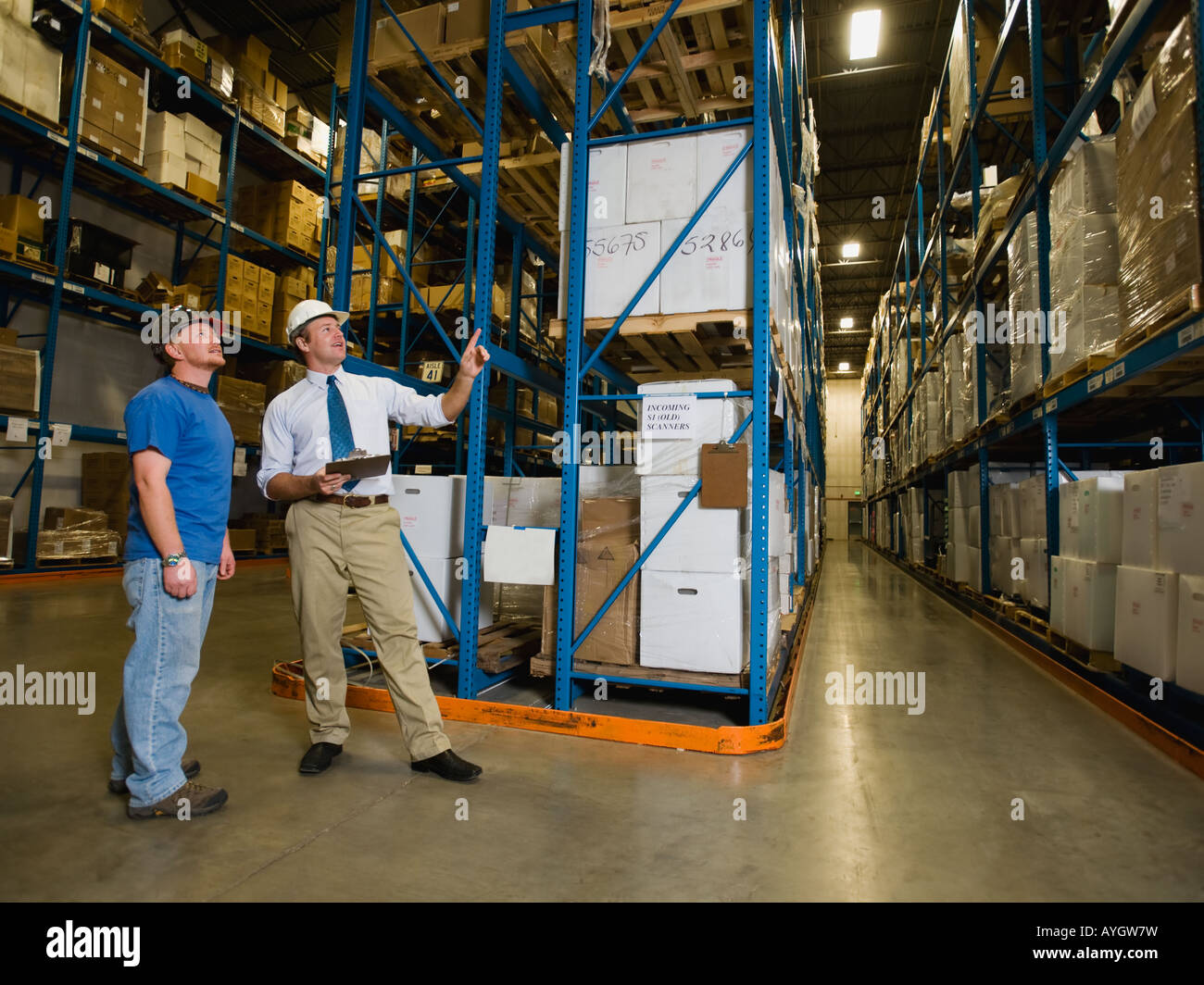 Warehouse workers checking inventory Stock Photo - Alamy