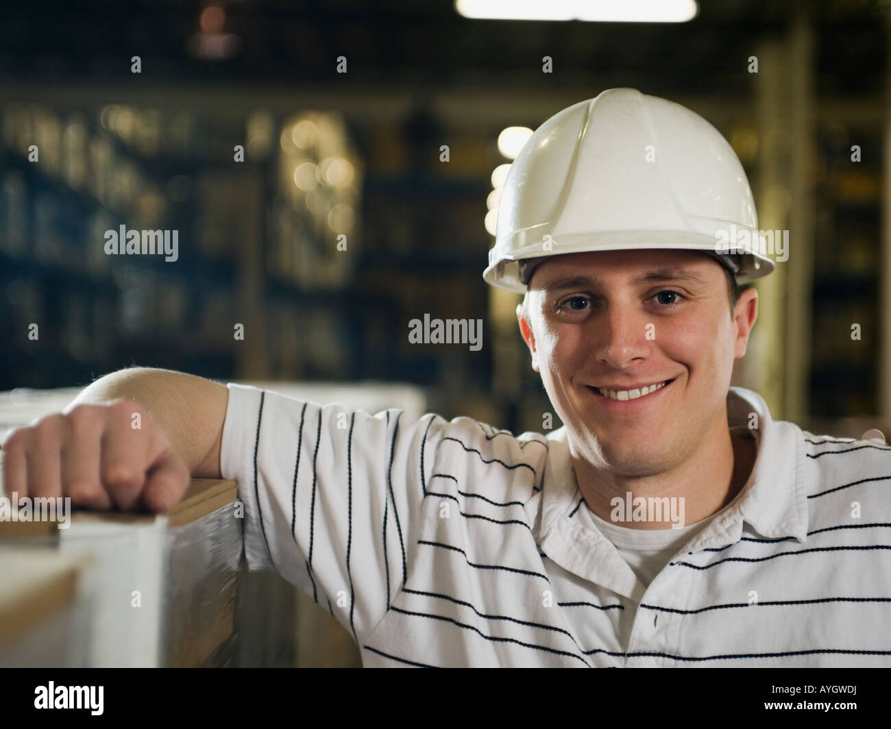 Warehouse worker wearing hard hat Stock Photo - Alamy