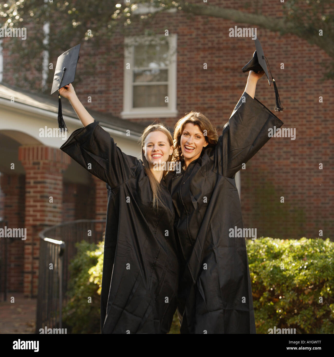 Women graduates cheering Stock Photo - Alamy