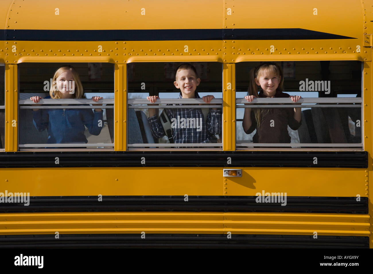 Children looking out school bus windows Stock Photo, Royalty Free Image ...