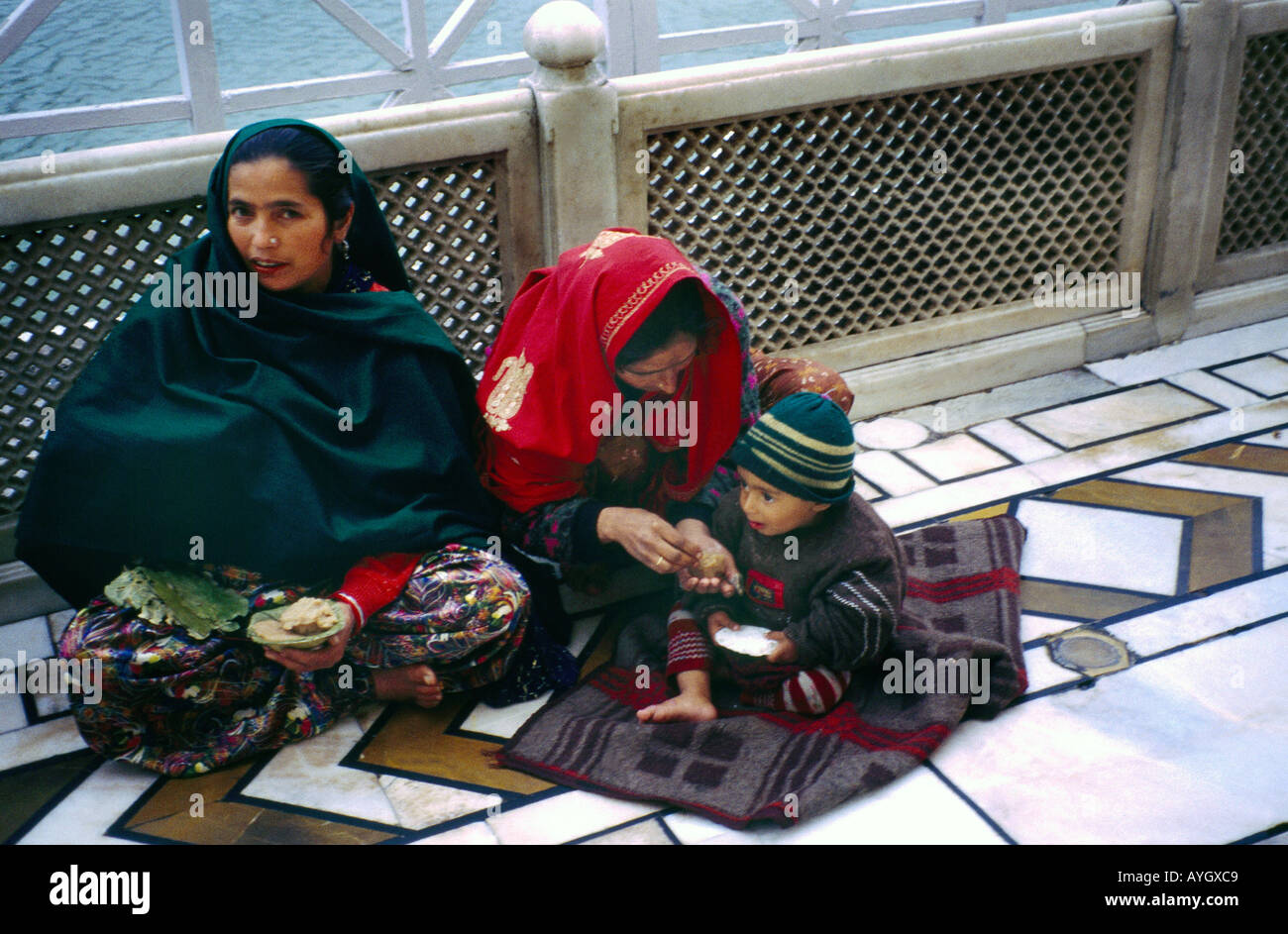 Amritsar India Eating Langar Using Leaf Plates & Bread Stock Photo - Alamy