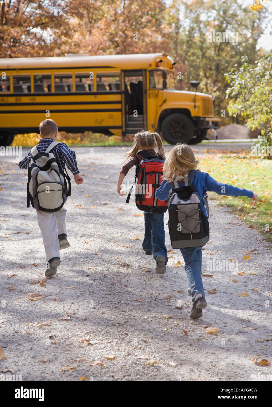 Children running towards school bus Stock Photo - Alamy