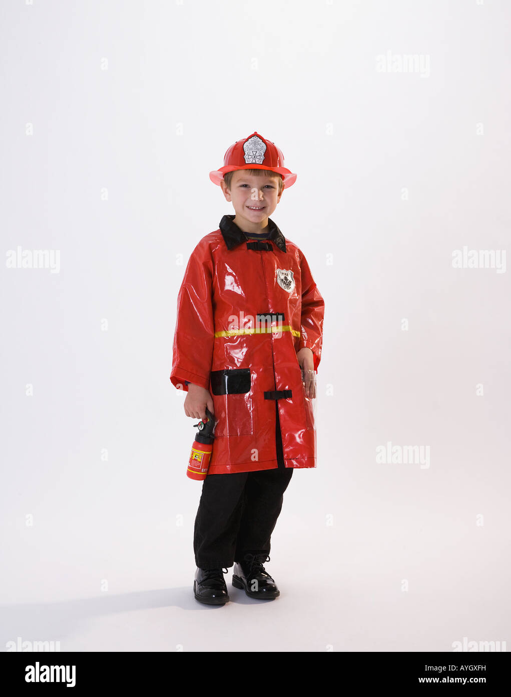 Boy dressed in fireman Halloween costume Stock Photo - Alamy