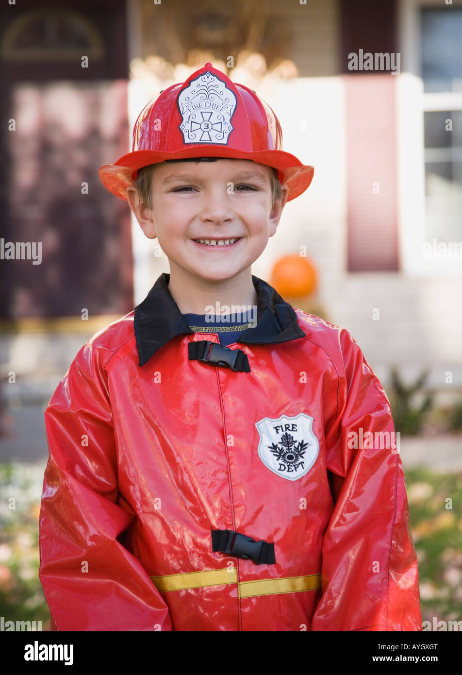 Boy dressed in fireman Halloween costume Stock Photo - Alamy