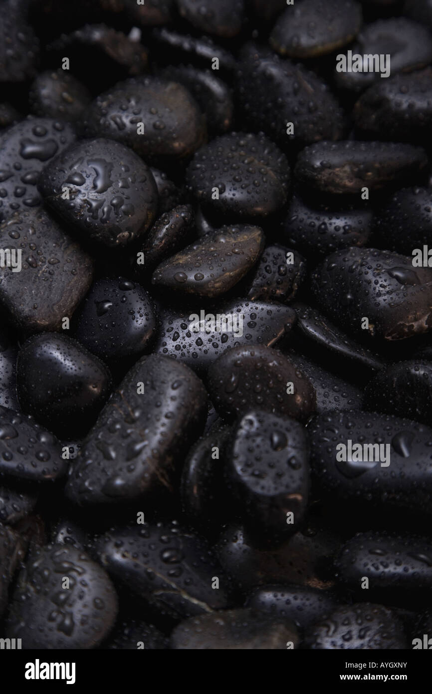 Close up of wet spa treatment stones Stock Photo - Alamy